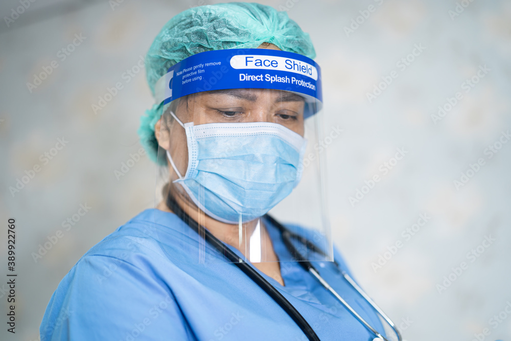 Asian doctor wearing face shield and PPE suit new normal to check ...
