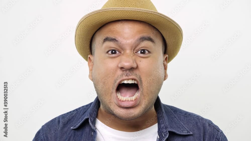 Angry Man in denim jacket closed his mouth with imaginary zipper and ...