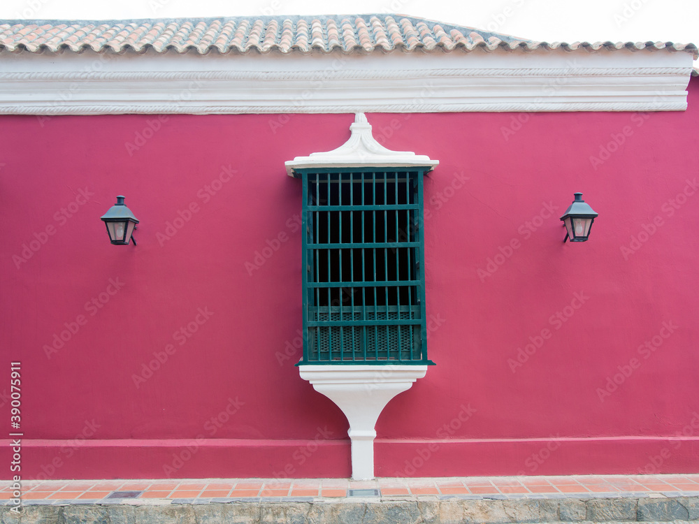 Colorful facade and colonial window of a house in the historic center ...