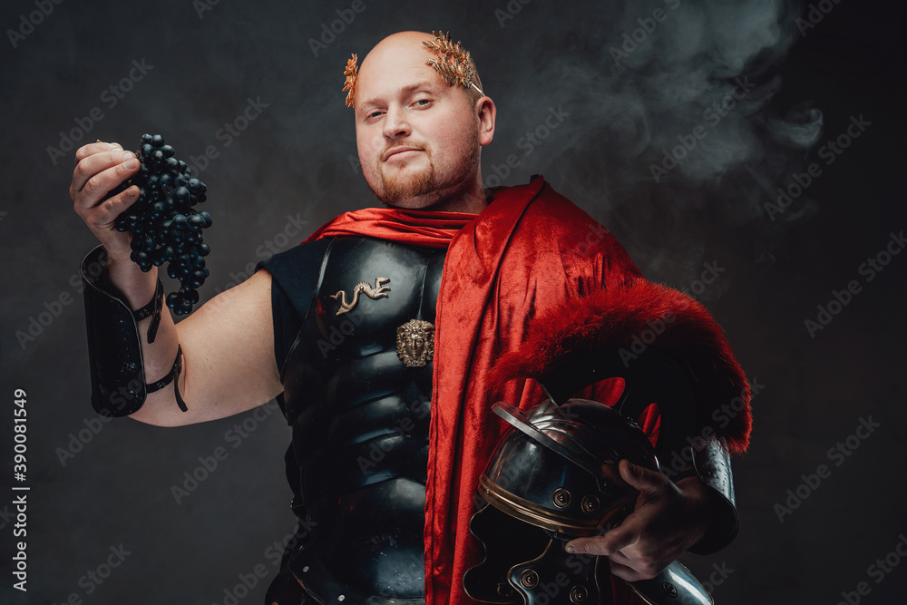 Status and handsome roman general in black armour and red cape with ...
