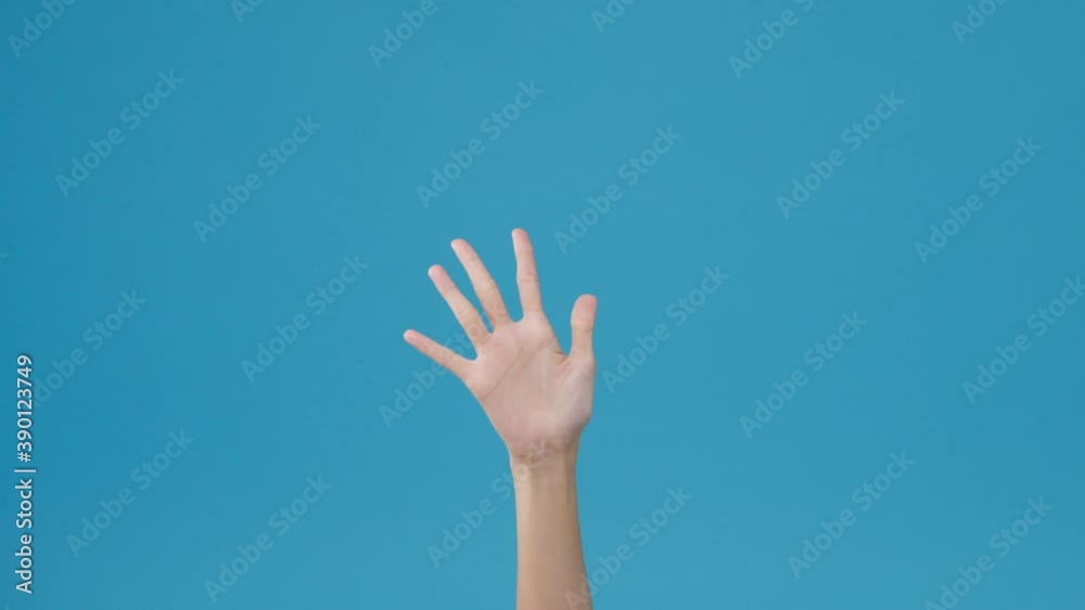 Stockvideon Young woman waving saying greeting, goodbye making hand ...