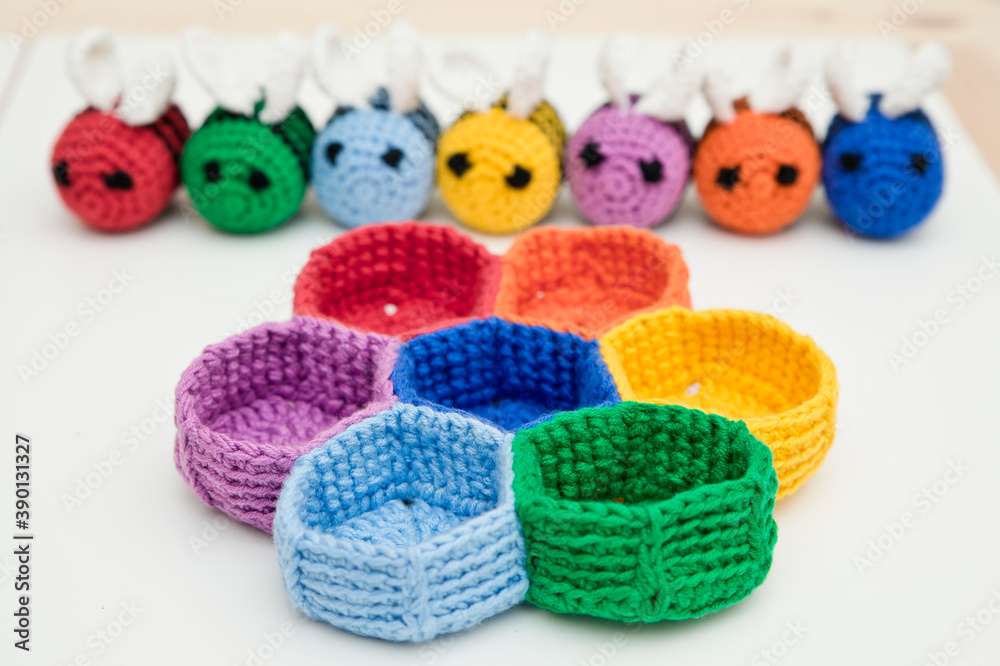 Colorful beehive with bees. Crochet safe toys for babies. Processed egg ...