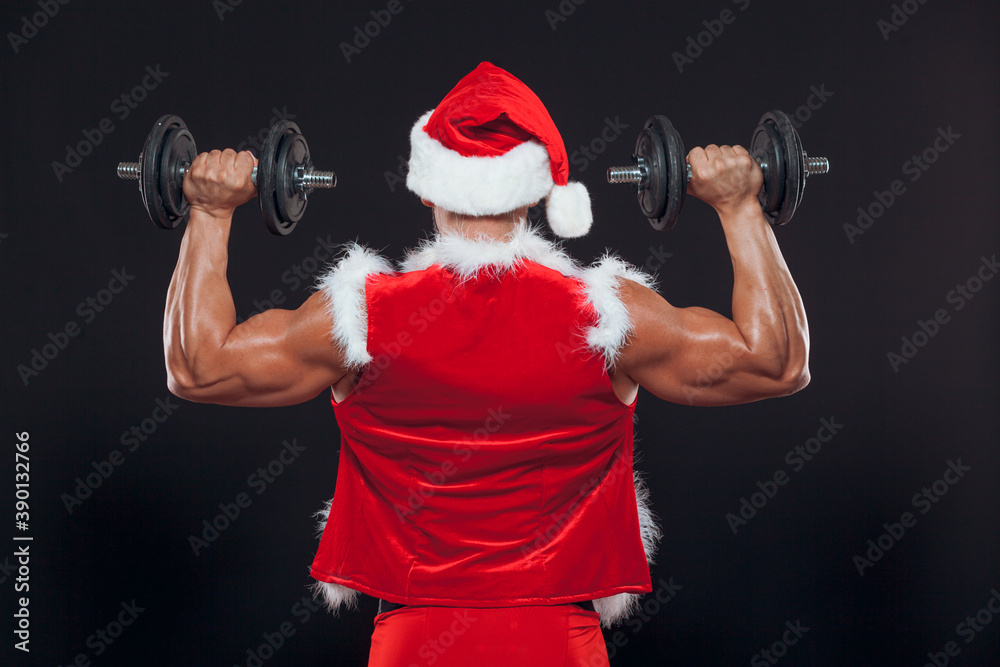 Sexy Santa Claus. Bodybuilder young handsome santa clause smile holds a ...