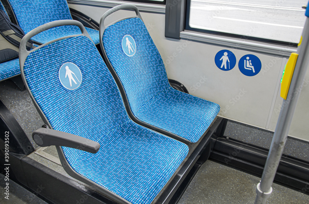 Fotografia do Stock: Blue fabric seats in the bus for elderly, people ...