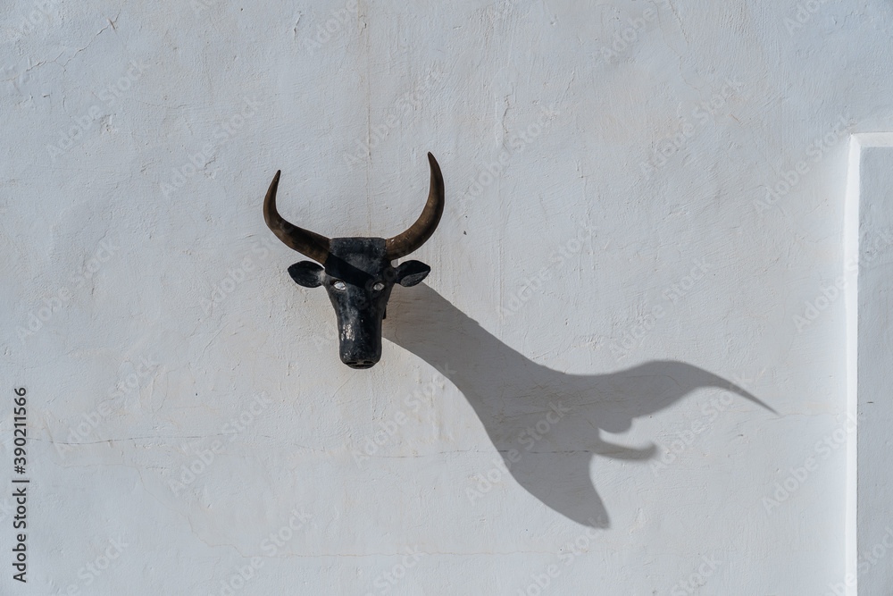 Building wall decorated with bull head statue Stock Photo | Adobe Stock