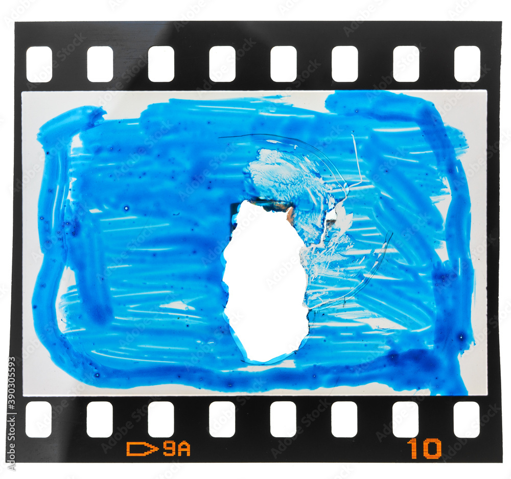 damaged or ripped 35mm film snip or strip with deep cutting hole and ...