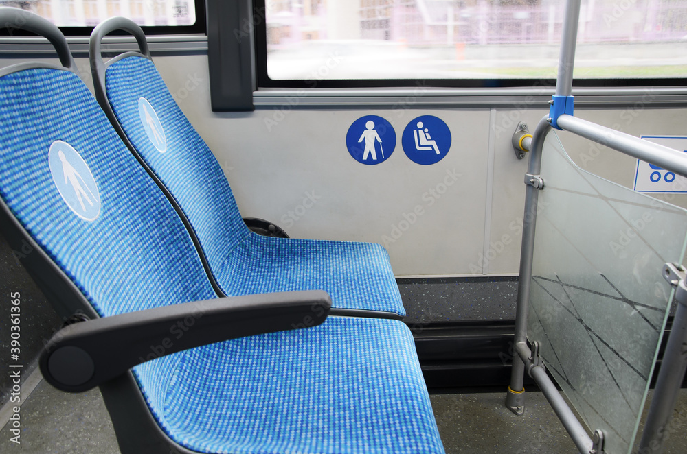 Blue fabric seats in the bus for elderly, people with disabilities and ...