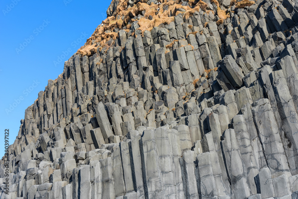 Black basalt columns of Reynisfjara, famous black-sand beach in the ...