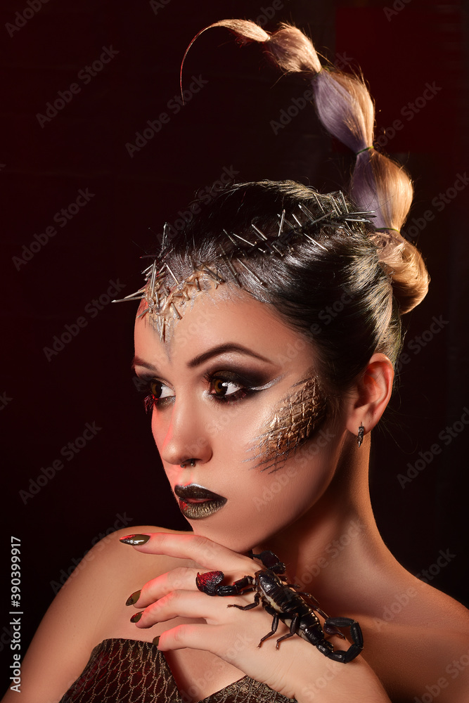 Beauty portrait of a girl with a live scorpion. Studio photography of a ...