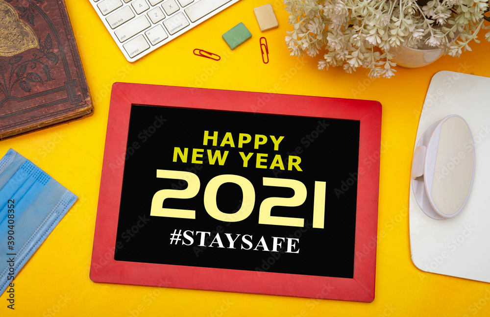 Happy New Year 2021 with stay safe sign during covid-19 on office table ...