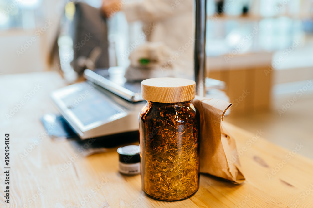 Zero waste shop interior. Wooden counter and shelves with different ...