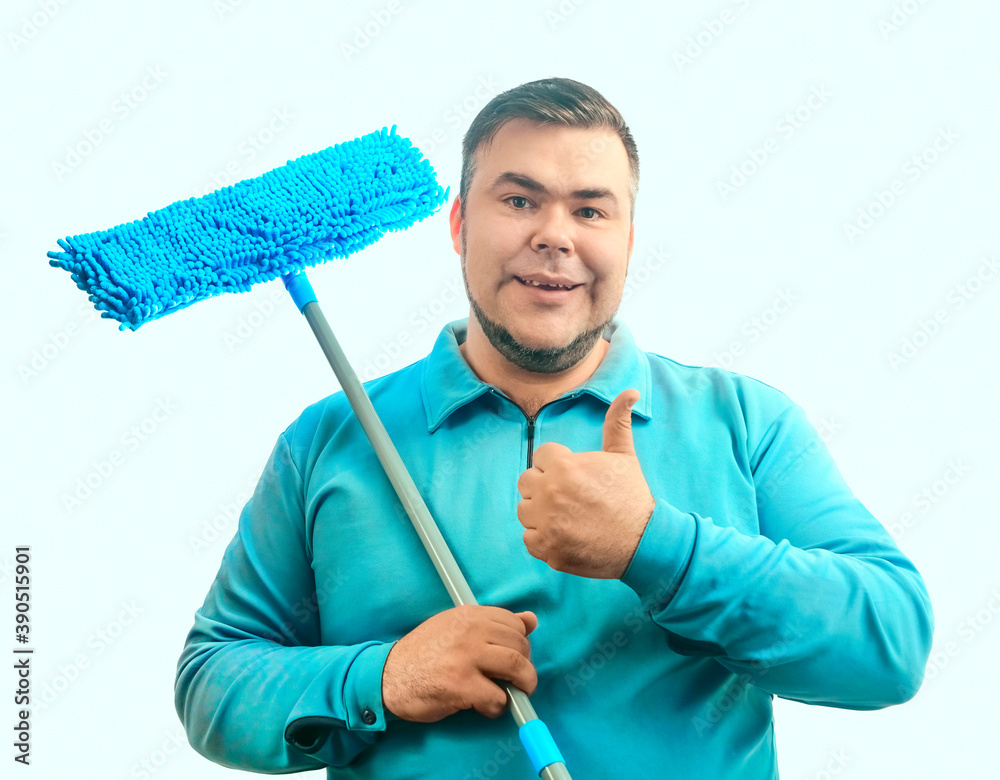 happy man holding mops for cleaning floor. middle age cleaning male ...