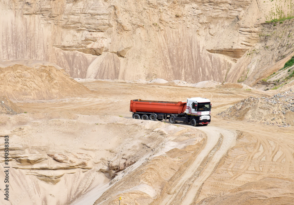Truck with tipper semi trailer transported sand from the quarry. Dump ...