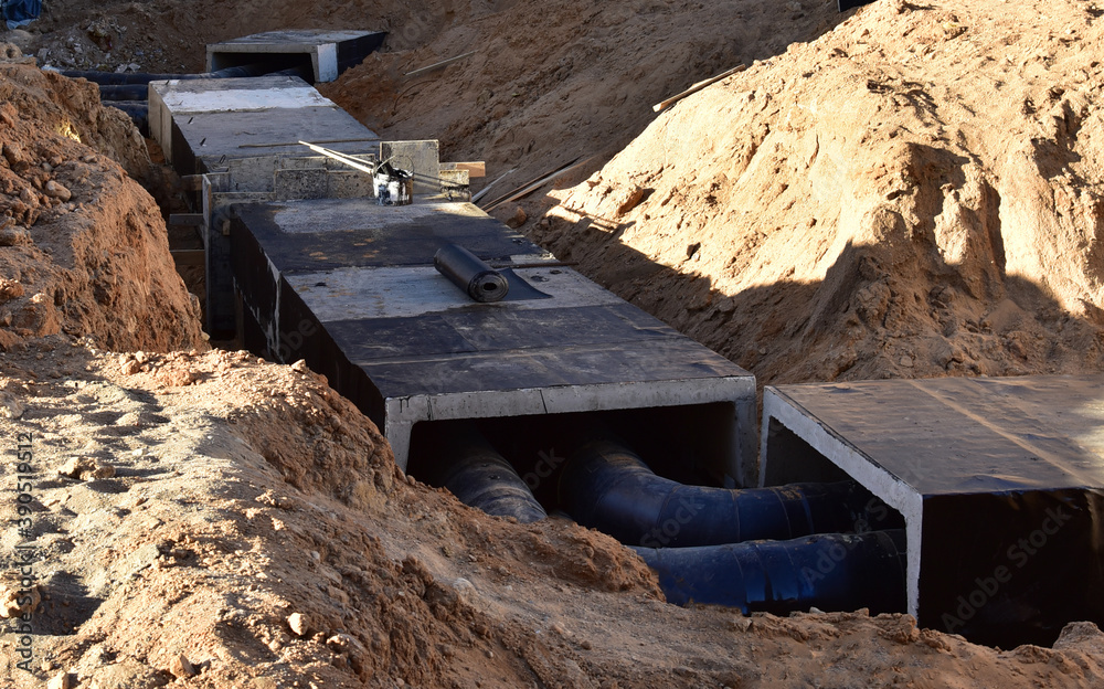 Painting bitumen at concrete wells, сhambers, manholes and pump station ...