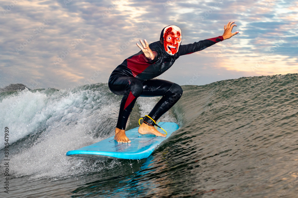Halloween Costume Surfing Various scary costumes worn by a surfer while ...