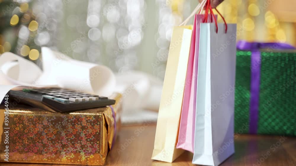 concept of holiday gift shopping and expenses showing with calculator ...