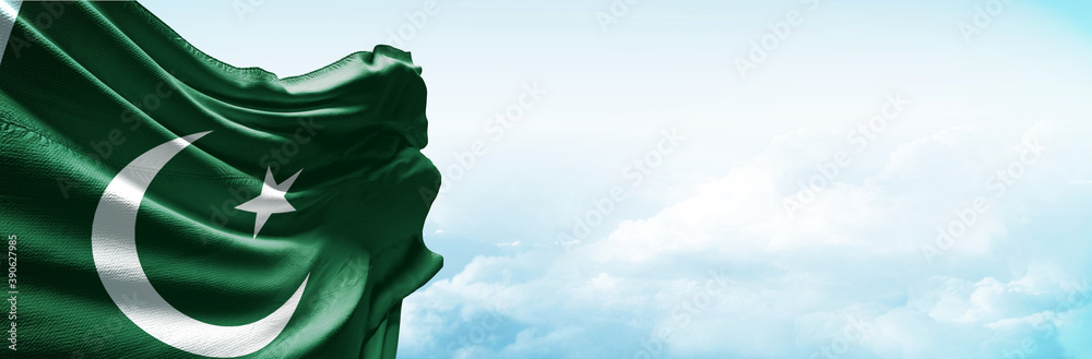 Pakistan flag in the blue sky. Horizontal panoramic banner. Stock Photo ...