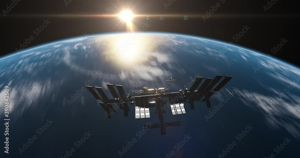 International Space Station (ISS) Orbiting Earth in Space during Sunset ...