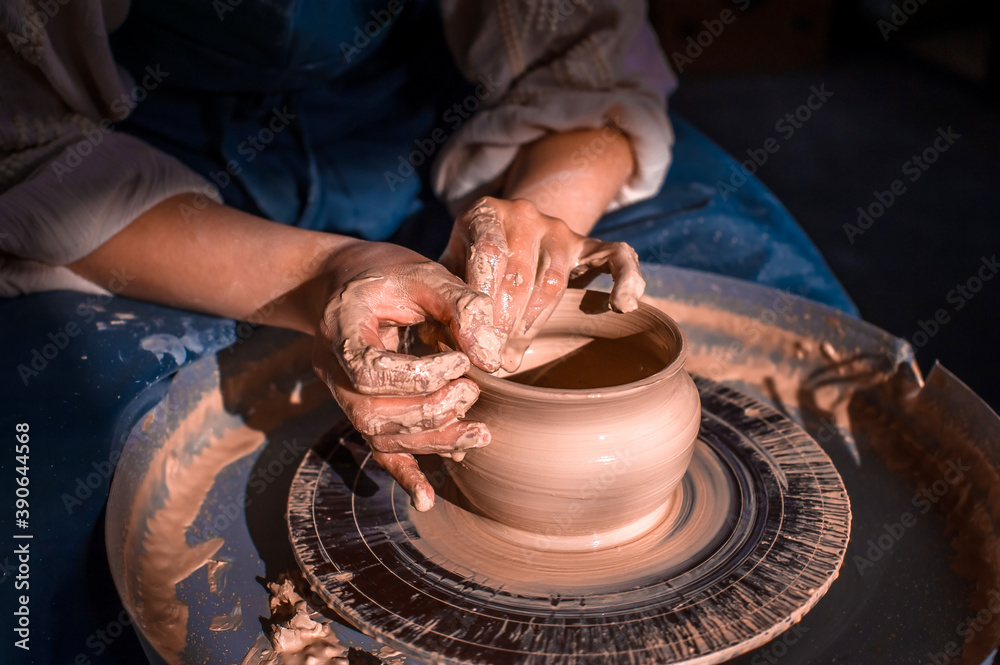 Craftsman master making ceramic pottery on wheel. Making ceramic dishes ...