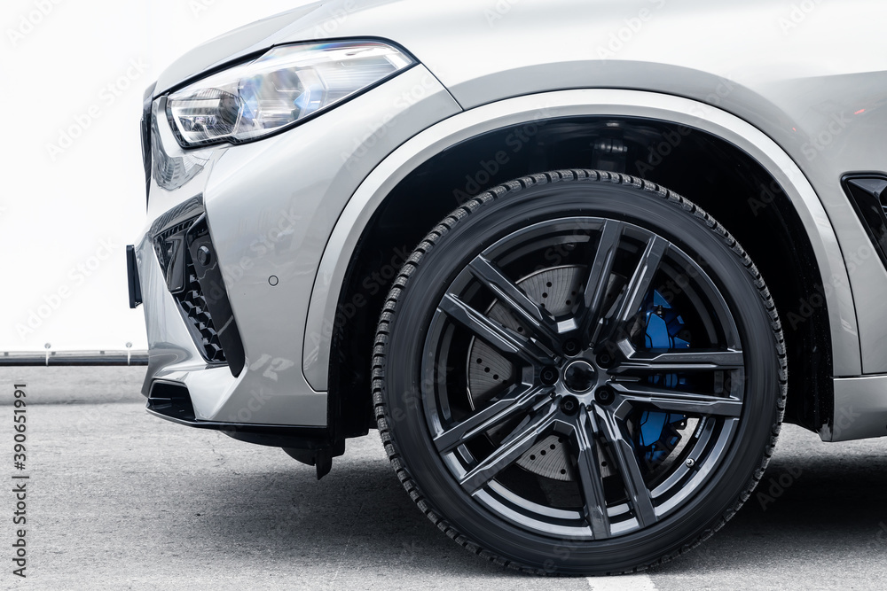 Silver new car side view: fender, side mirror, wheel, bumper and hood ...