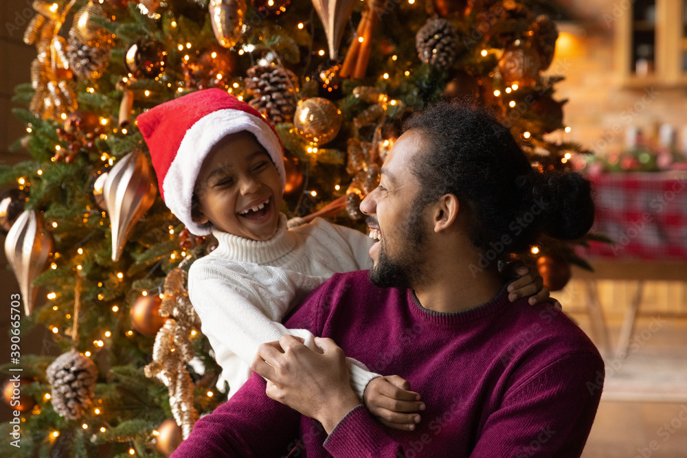Close up overjoyed African American father and little son wearing ...