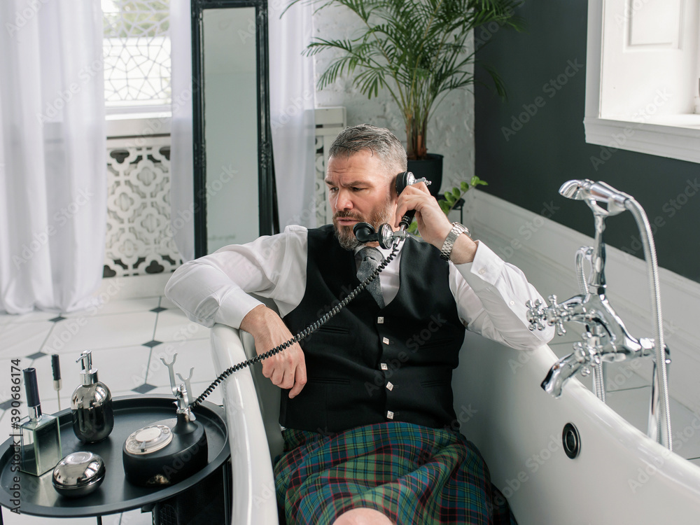 handsome mature courageous stylish man scotsman in kilt and suit ...