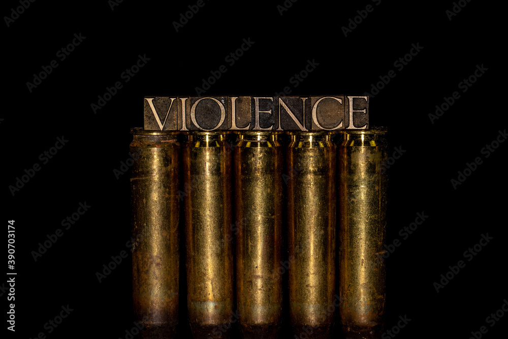 Violence text formed with real authentic typeset letters on top of row ...
