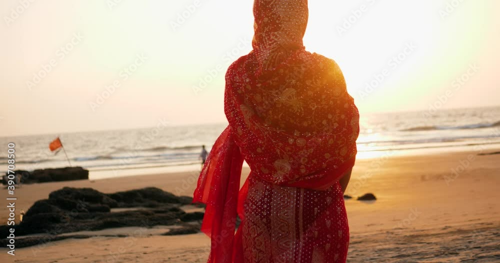 Young women wearing a red saree on the beach goa India.girl in ...