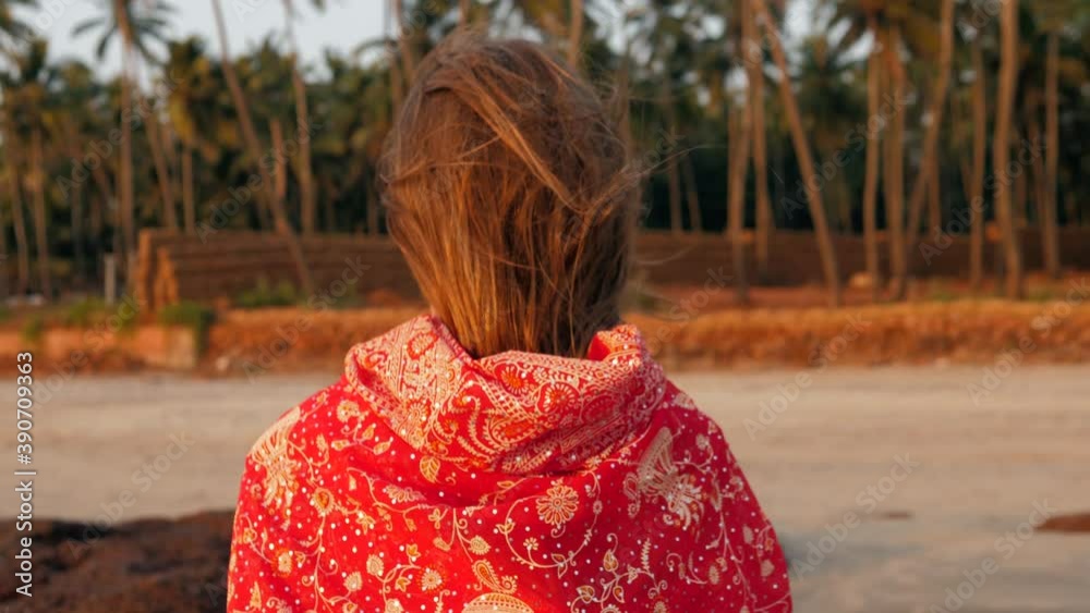 Video „Young women wearing a red saree on the beach goa India.girl in ...