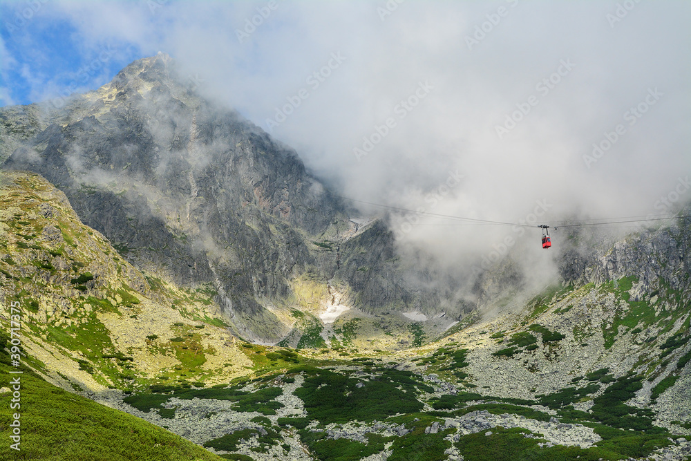 Red cable car from the Tatra Mountains to the Lomnicky Peak. Beautiful ...