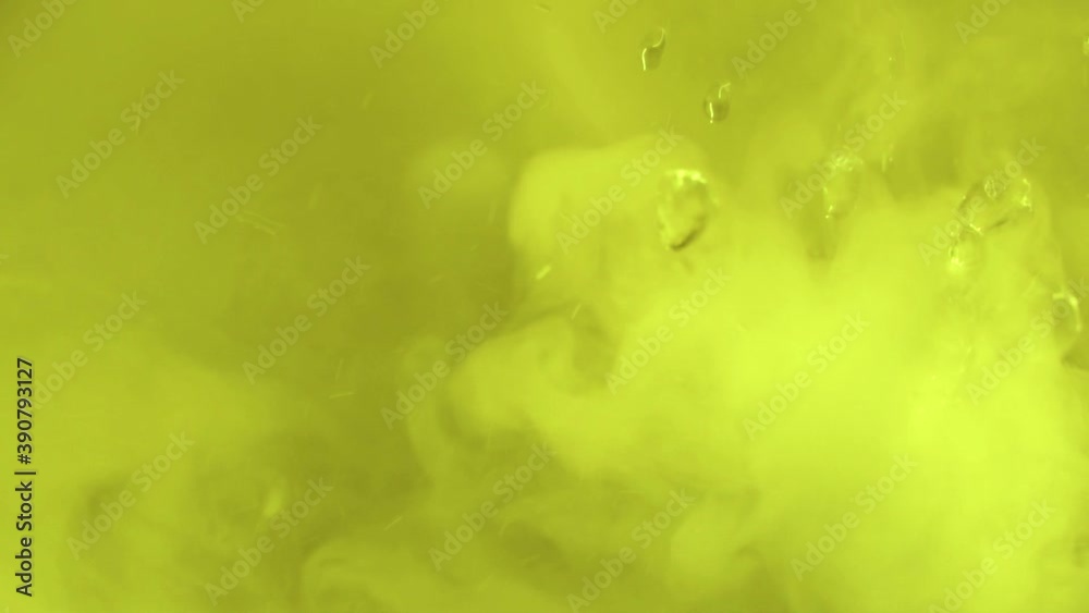 Abstract steam mist of green color on a black background.A gaseous ...