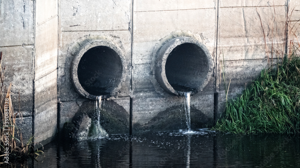 Gutter. Water runoff from a street spillway (water disposal, storm ...
