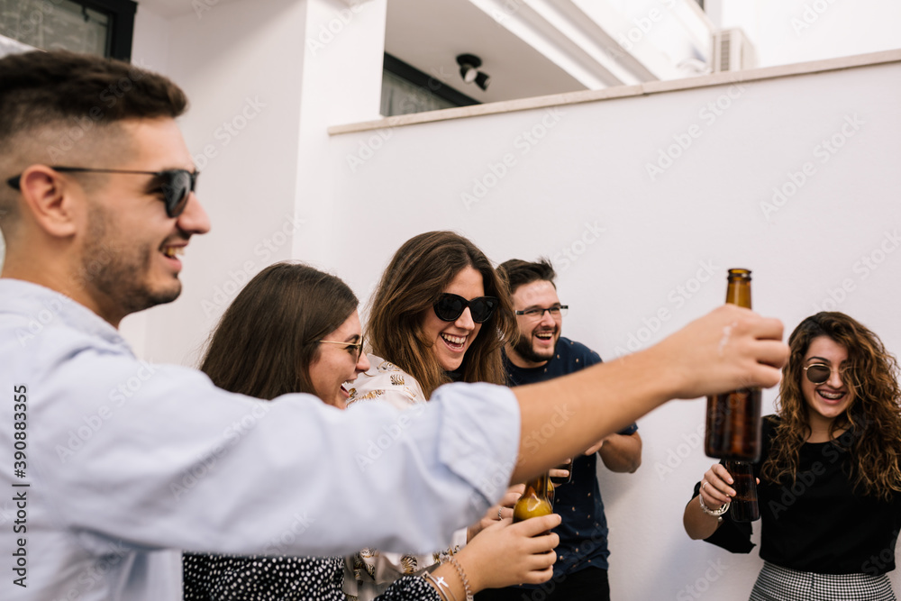 partying teens drinking beer Three girls and two boys appear laughing ...