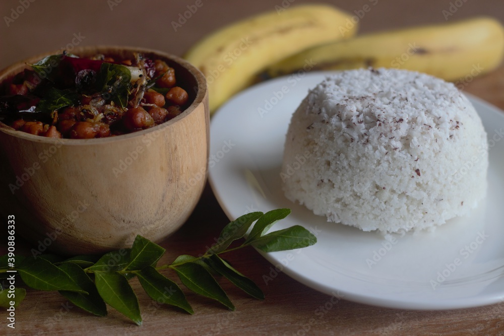 Steamed rice cake with layers of freshly grated coconut in between, a ...