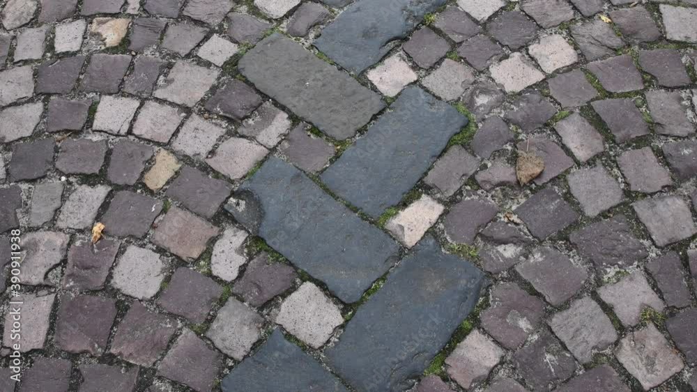 Ancient stone paving road in old town. Cobblestone pavement with ...