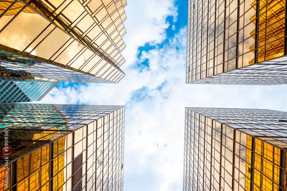 Golden skyscrapper building with blue sky in Hong Kong. Windows glass ...