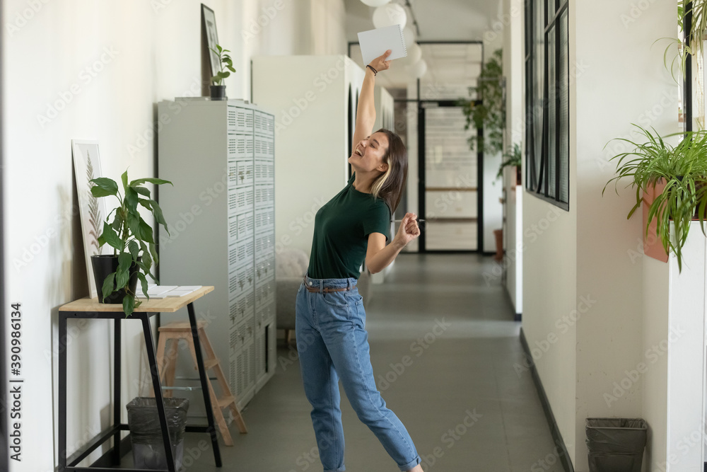 Hooray. Overjoyed excited millennial female office worker manager ...