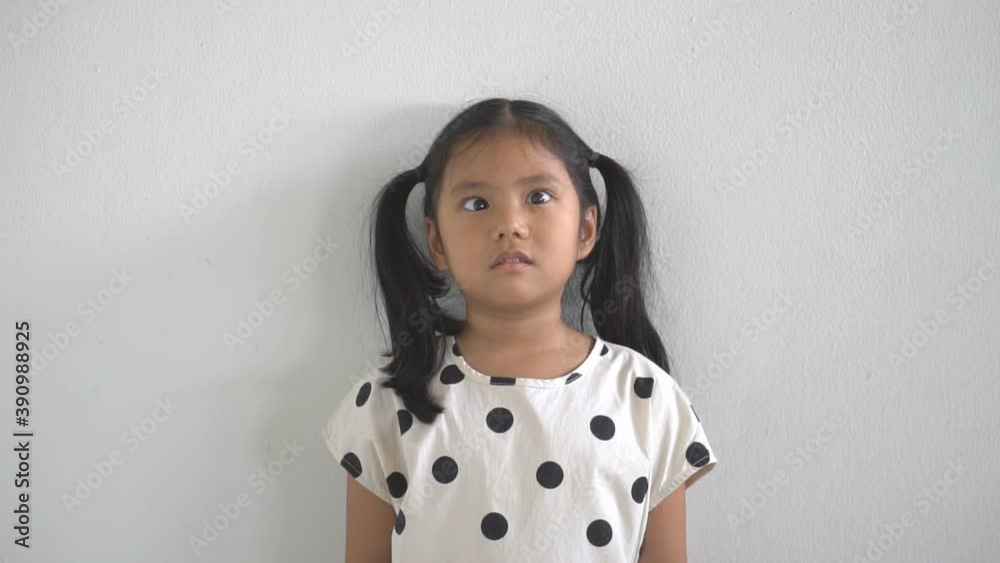 Asian child make strabismus or kid girl play squint lazy eye and ...