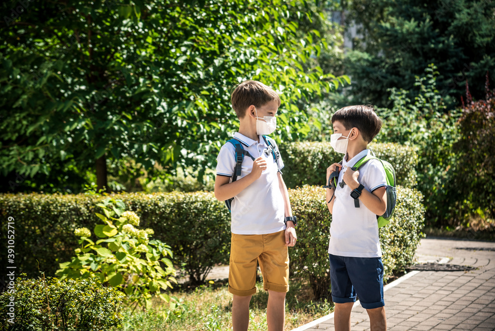 Kids wearing mask and backpacks protect and safety from coronavirus for ...