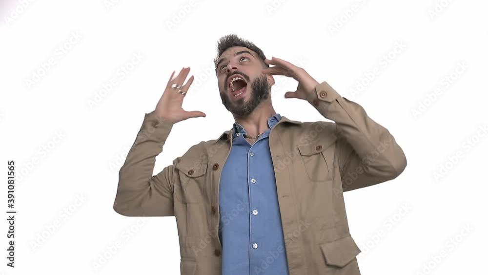 attractive casual guy making crazy faces and screaming, smiling ...