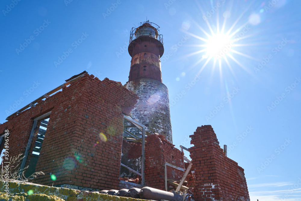 Lighthouse built of red bricks, located on isla pinguino at the coast ...