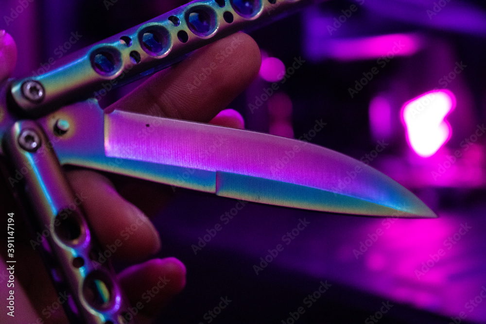 Butterfly knife with LED background Stock Photo | Adobe Stock