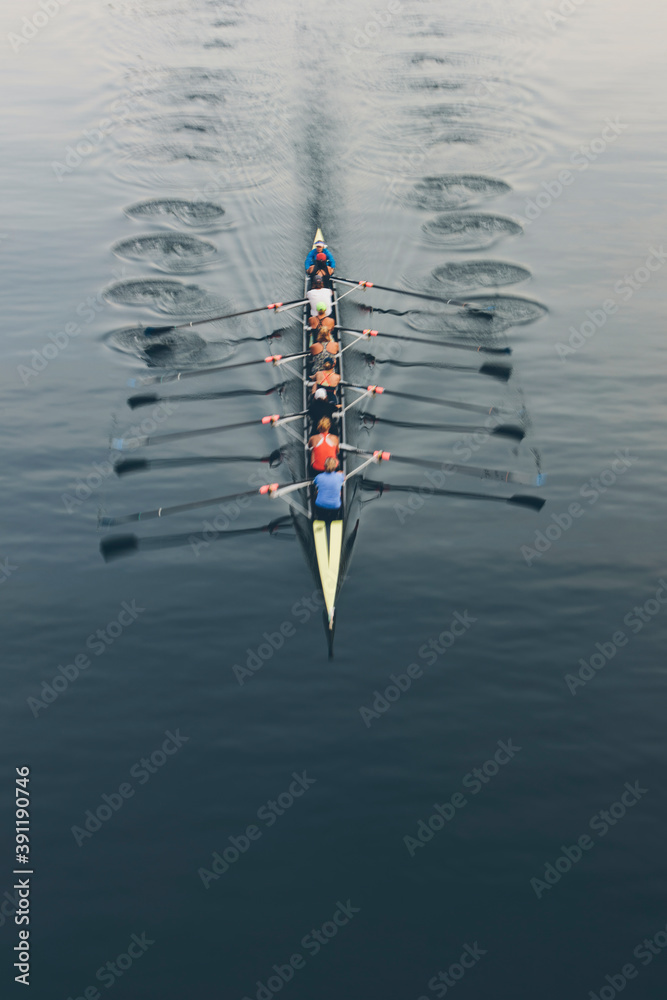 Overhead view of a crew in an eights boat rowing on a lake Stock Photo ...