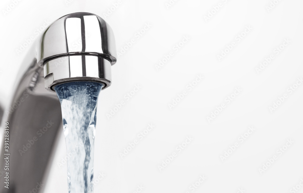 Faucet with water drop on white background Stock Photo | Adobe Stock