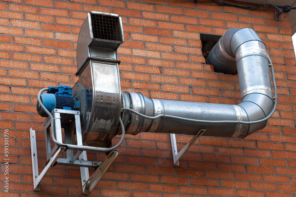 External engine of the building's exhaust system structure, mounted on ...