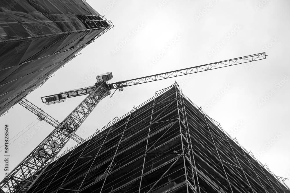 Construction site jib crane. Construction of new modern buildings ...