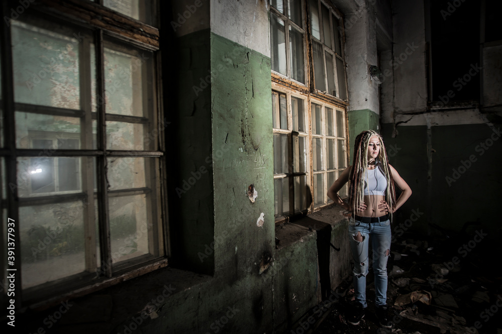 Sexy woman look in dirty window of old ruined house Inside dusty dirt ...