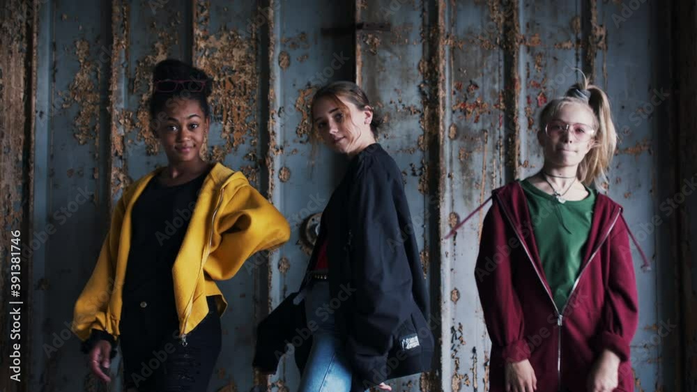 Vidéo Stock Group of teenagers girl gang standing indoors in abandoned ...