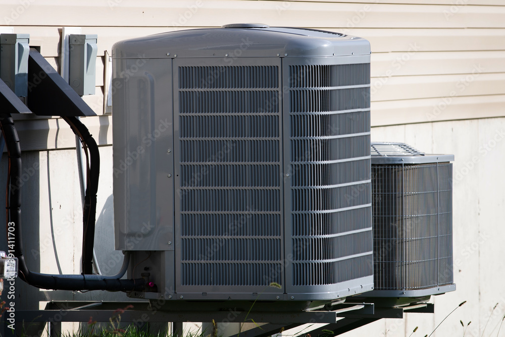 Air conditioning system unit installed outside facade of the new house ...