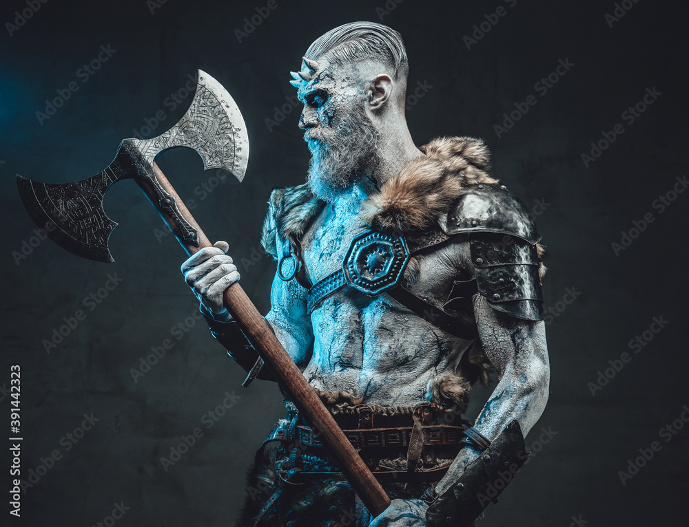 Shirtless and pale skinned warrior with horns and blue eyes dressed in ...